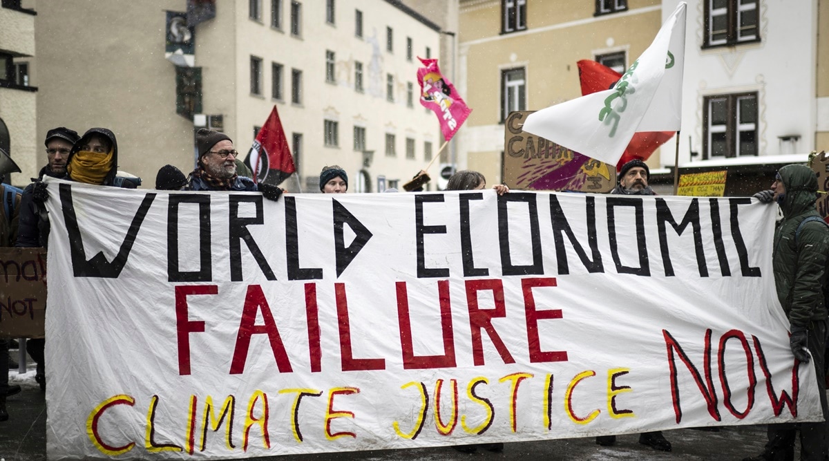 Braving snowfall, climate activists protest against World Economic ...