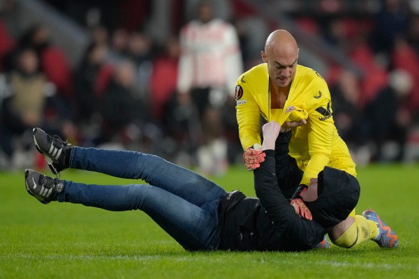Watch: Fan punches Sevilla goalkeeper in Europa League match at PSV ...