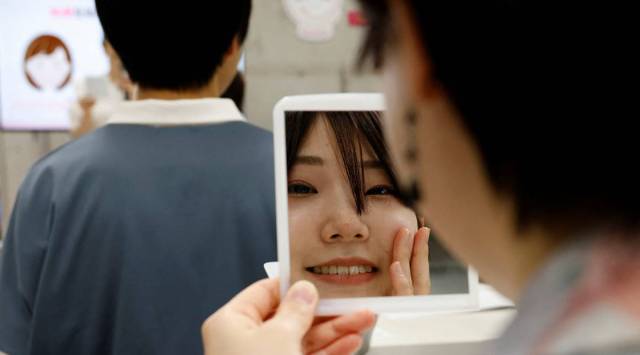 Japanese get trained in ‘Hollywood’ smiles as masks slowly come off ...