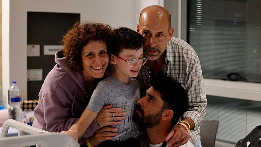 Watch: 9-year-old freed by Hamas runs to hug his father in Israel ...