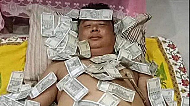 Assam: Suspended UPPL member’s photo of sleeping with bundles of money ...