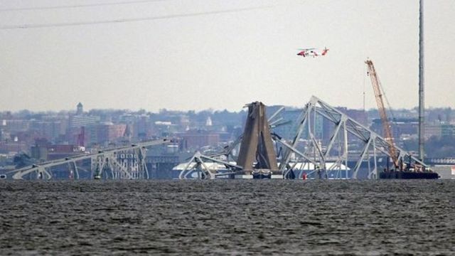 Massive crane put in place to clear Baltimore bridge debris as crews ...