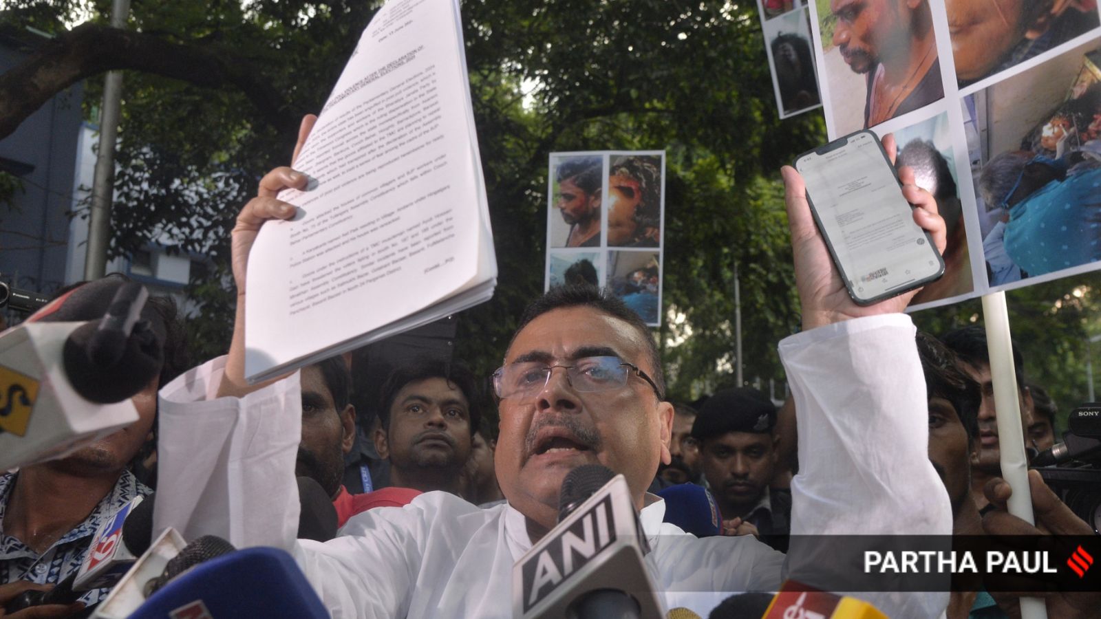 Police stop BJP’s Suvendu from entering Raj Bhavan with ‘poll violence ...