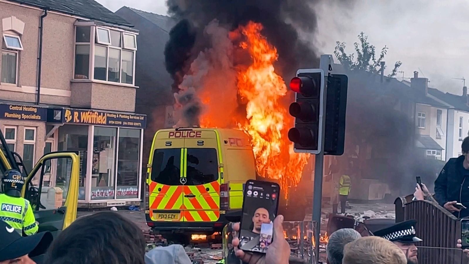 Watch | Police van set on fire as clashes break out at England’s ...