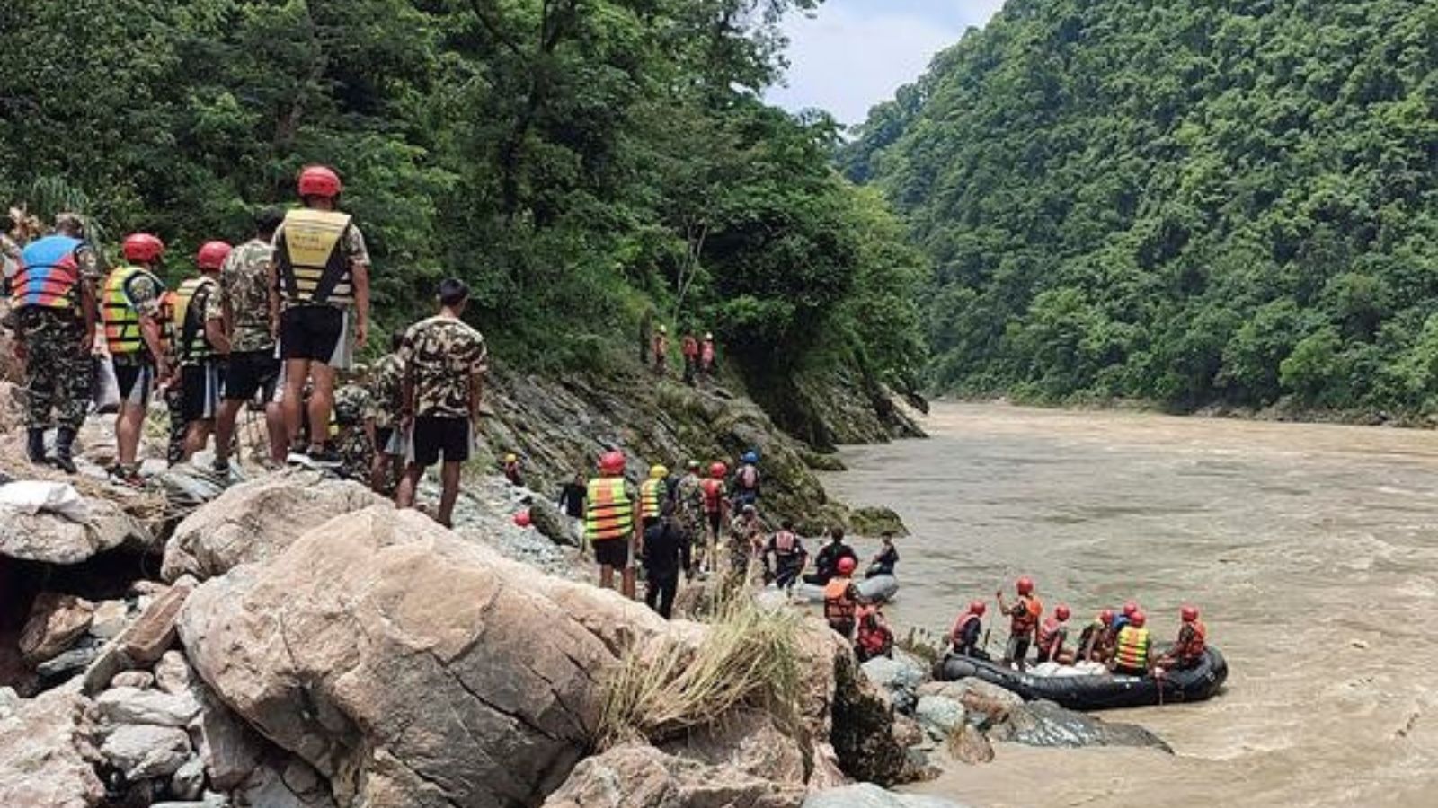 Rescuers recover body of Indian from two buses swept away in mudslide ...