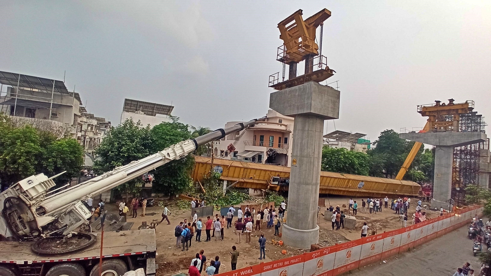 Crane falls on building during Metro work in Surat | Ahmedabad News ...