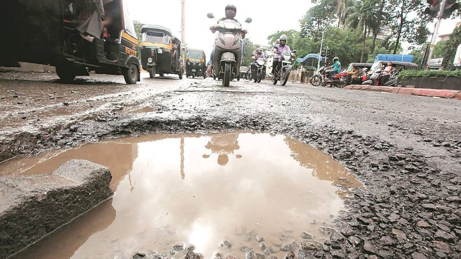 With cutouts, BJP launches campaign against potholes in Delhi | Delhi ...