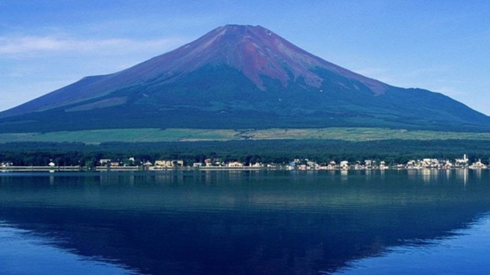 Mount Fuji gets its trademark snowcap after longest delay in 130 years ...