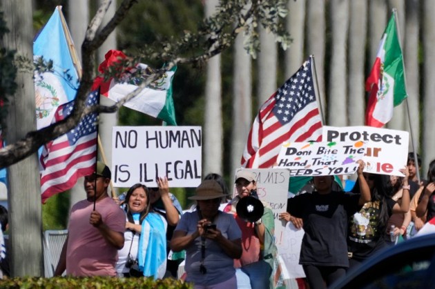 In photos: Protesters gather outside Trump’s golf club over immigration ...