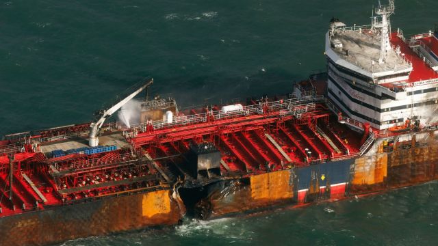 Man arrested over UK tanker crash as abandoned vessels smoulder at sea ...