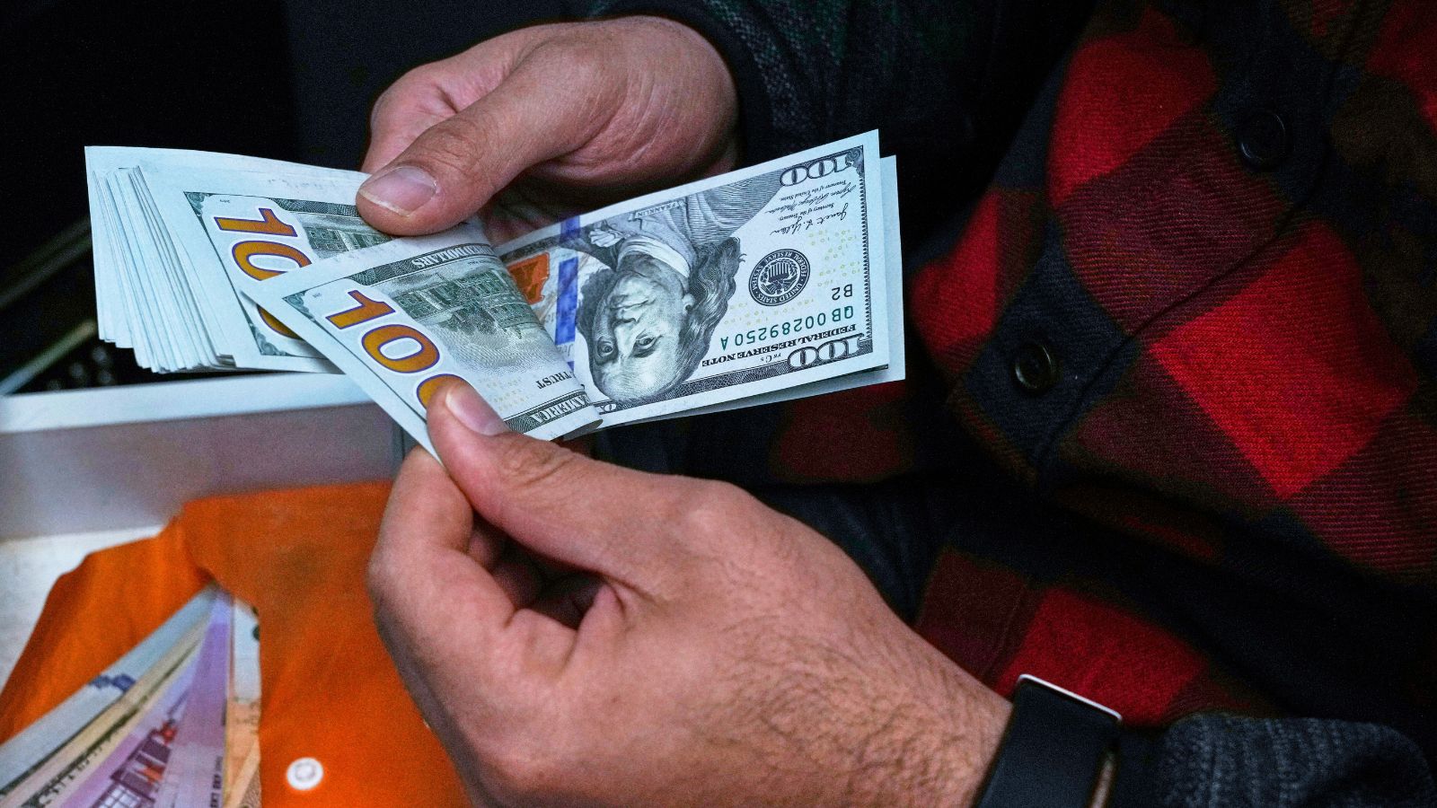 Iran’s currency falls to record low against the dollar as tensions run ...