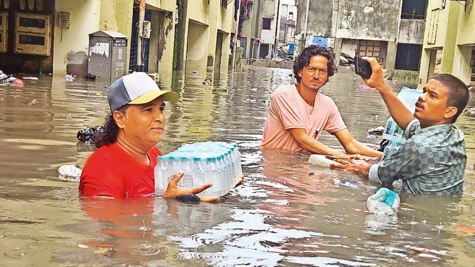 Wading through chest-deep water, how fire dept came to rescue of flood ...