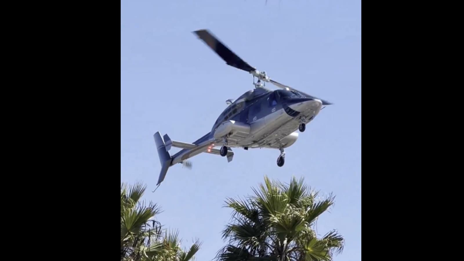 Watch: Helicopter spirals midair before crashing at Huntington Beach in ...
