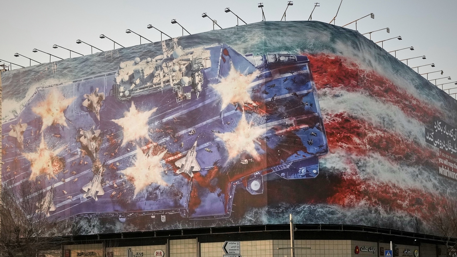 Iran unveils mural warning of retaliation if US conducts a military ...